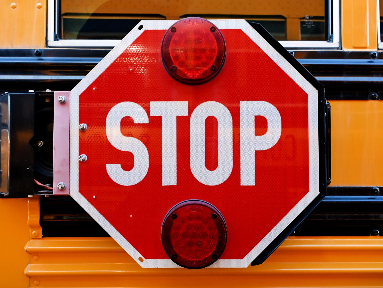 County attorney reminds drivers it is illegal to pass stopped school buses